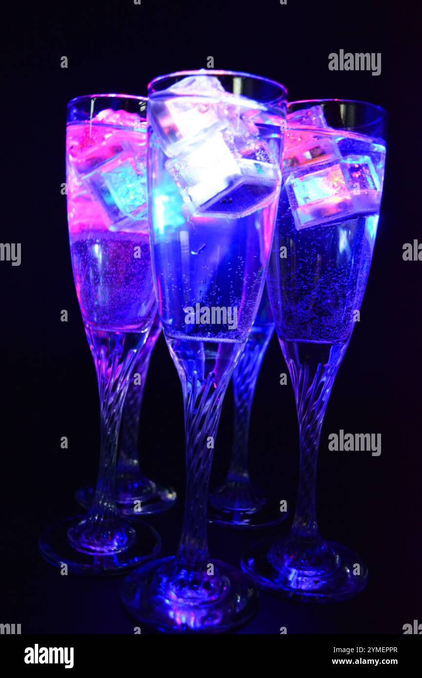 Colorful glasses, champagne glasses with fizzy drink, carbonated sweet ...