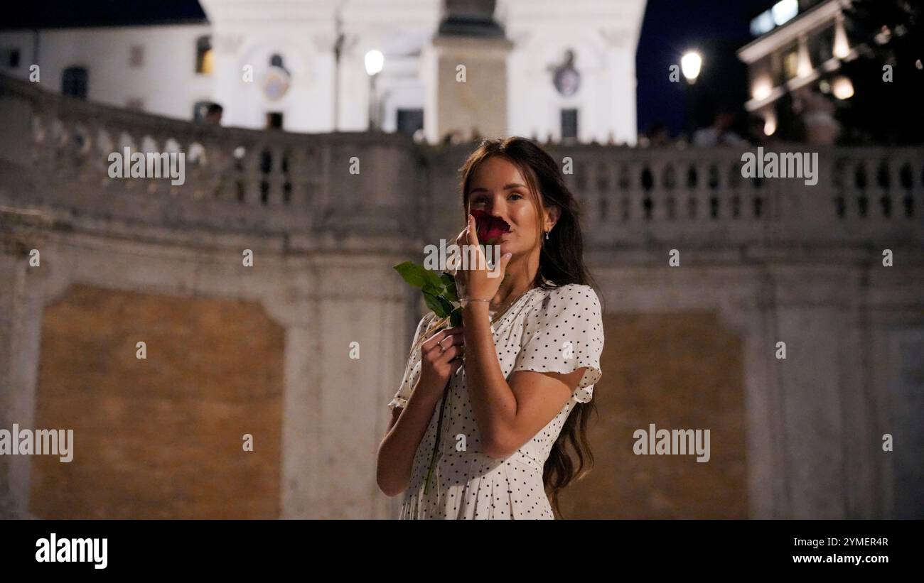 Charming Night Scene: Woman with Red Rose Relaxing on Roman Steps Stock ...