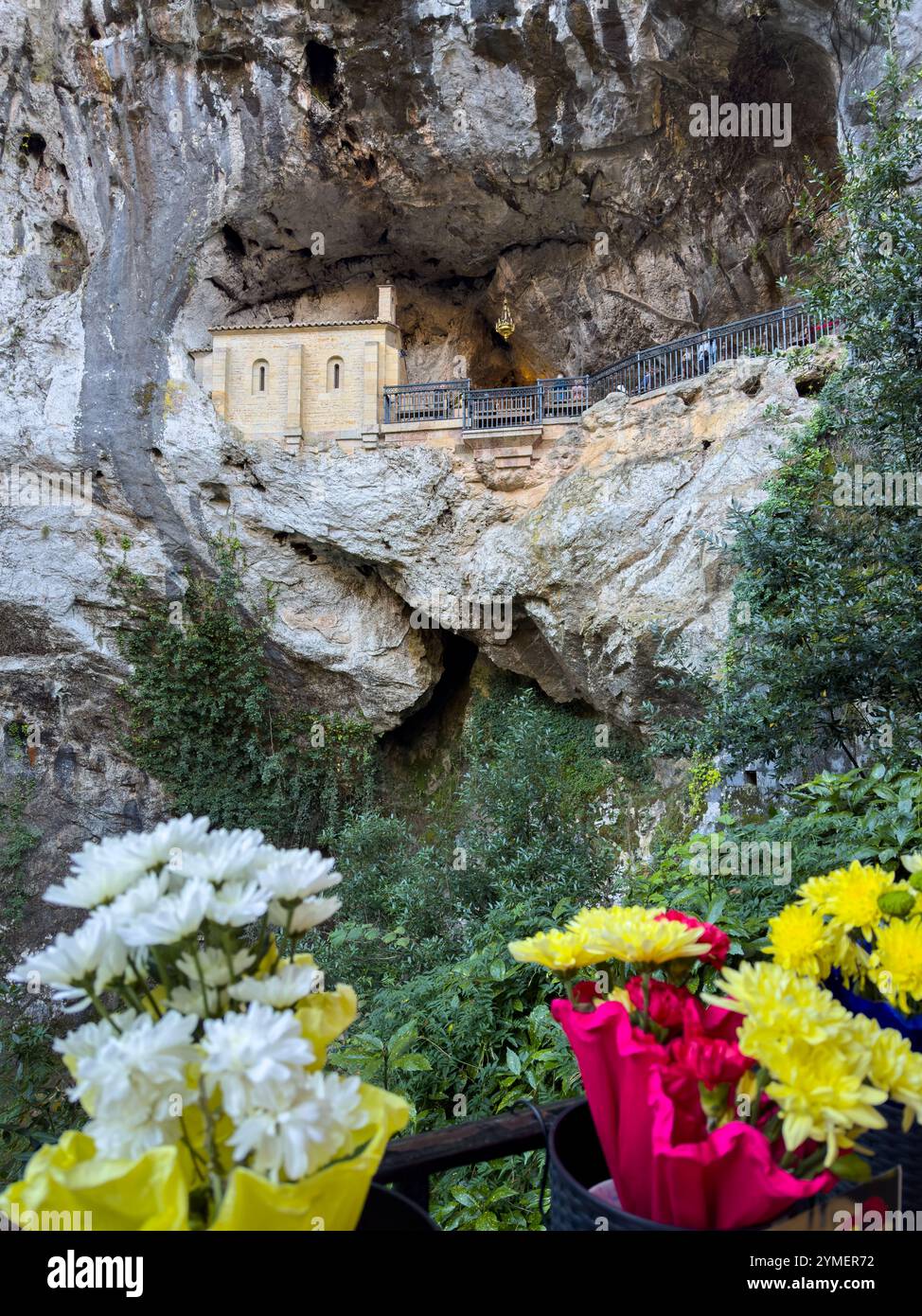 Sanctuary of the Holy Cave of Covadonga built into the rock with ...