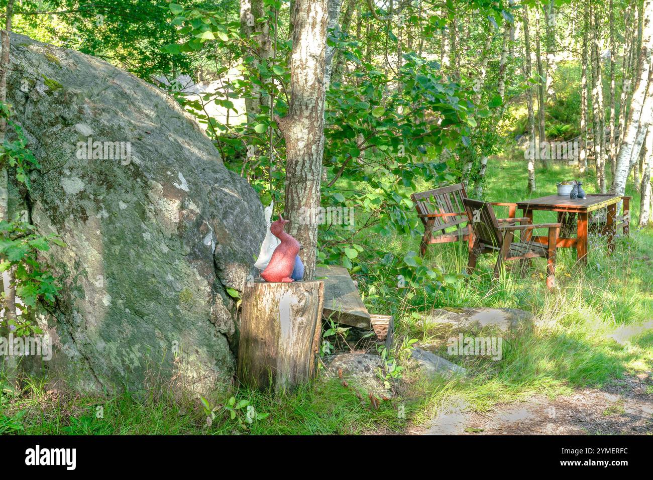 Romantic garden idyll close to nature under trees Stock Photo - Alamy