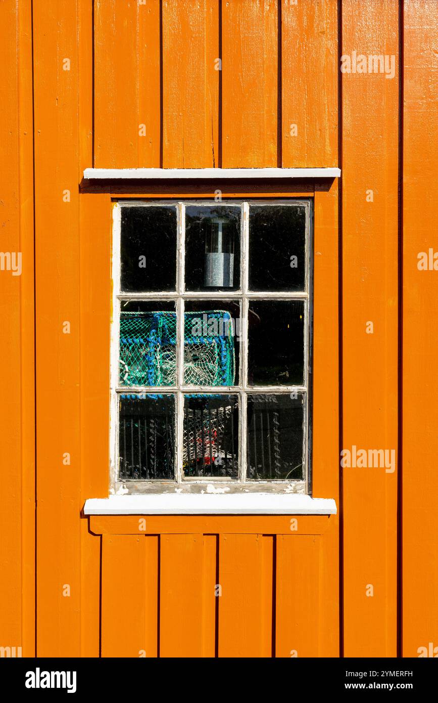 Window of an old fishermans hut with a blue fish basket Stock Photo - Alamy