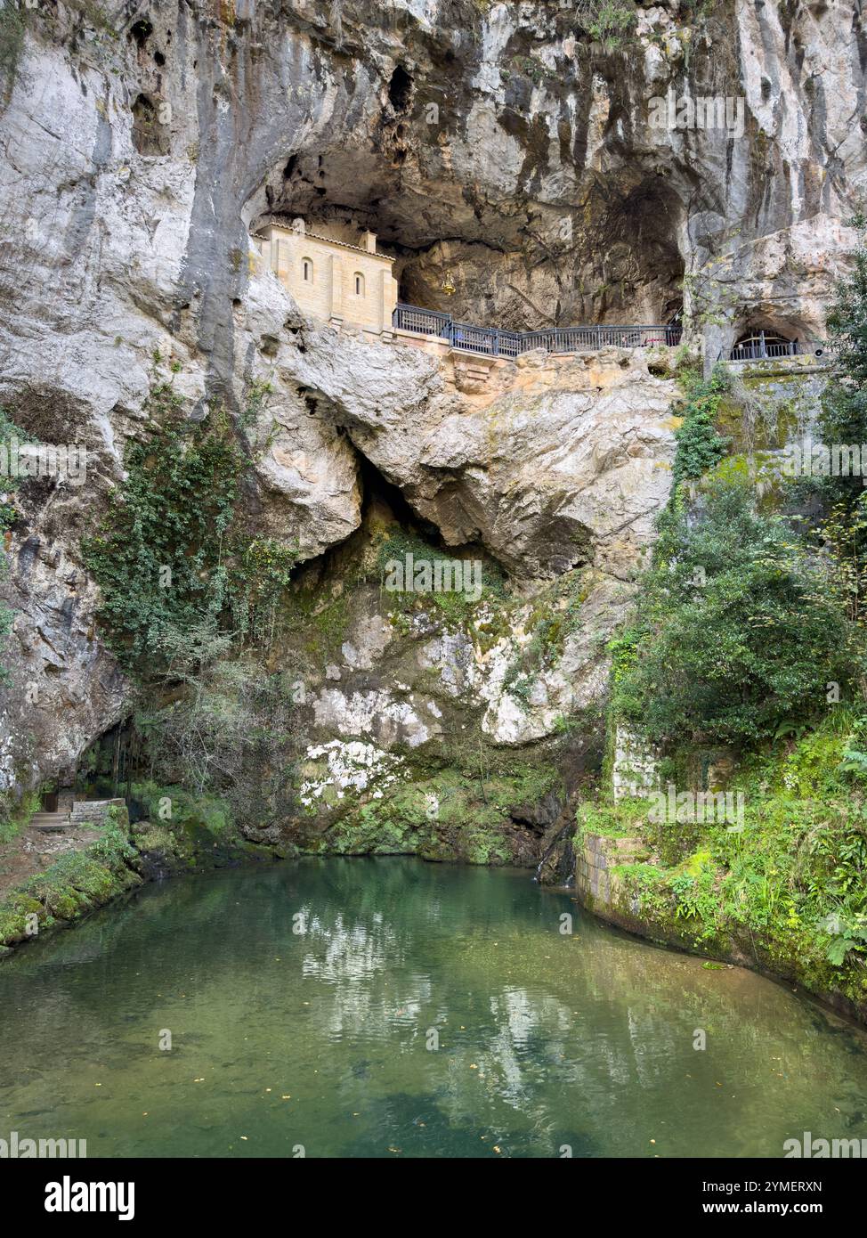 The Holy Cave of Covadonga with the fountain of the seven spouts in the ...