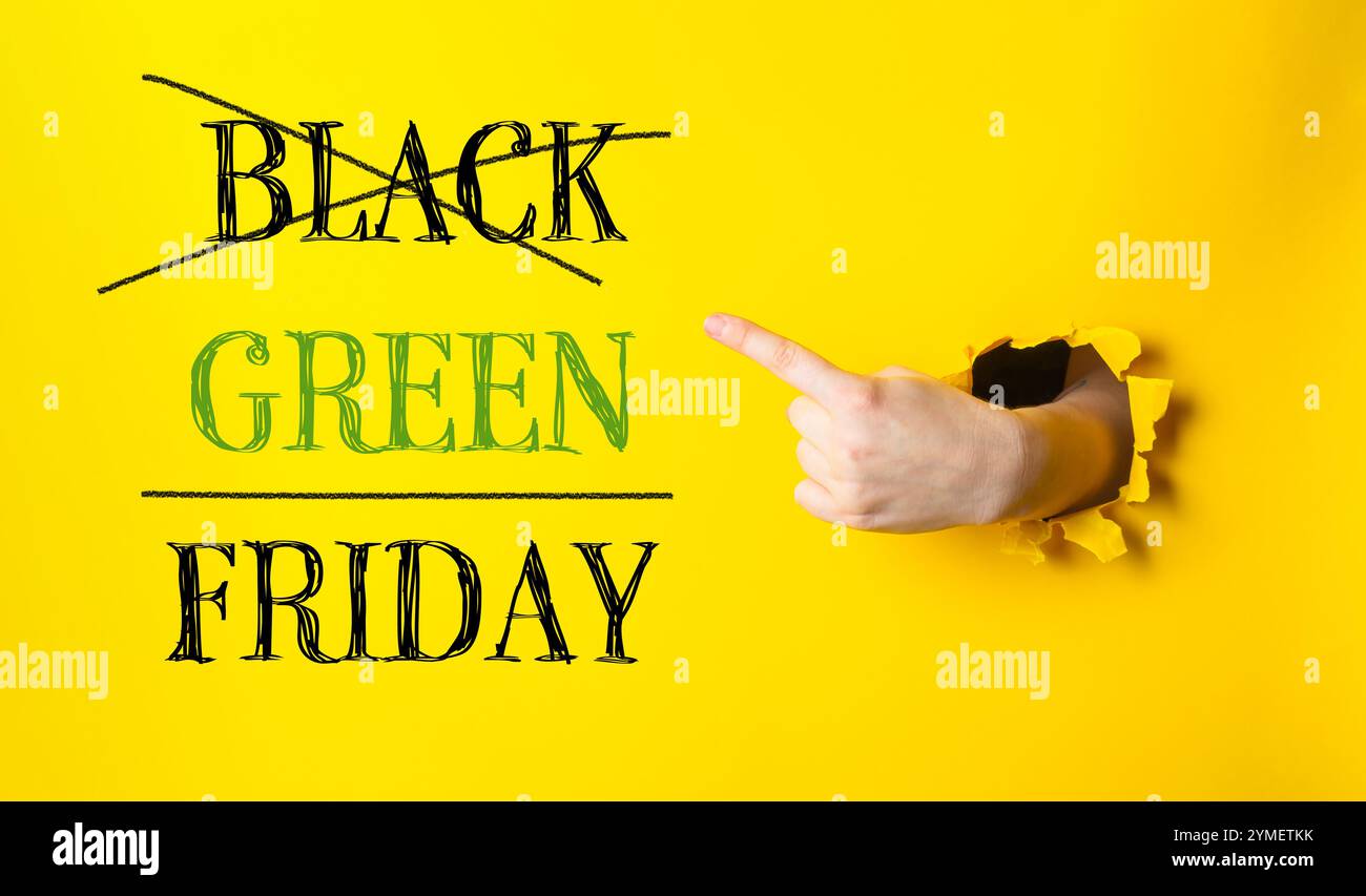 Hand pointing to a yellow background with the words Black Green Friday ...