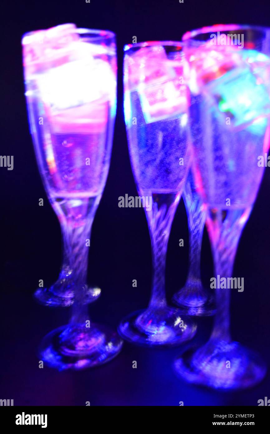 Colorful glasses, champagne glasses with fizzy drink, carbonated sweet ...