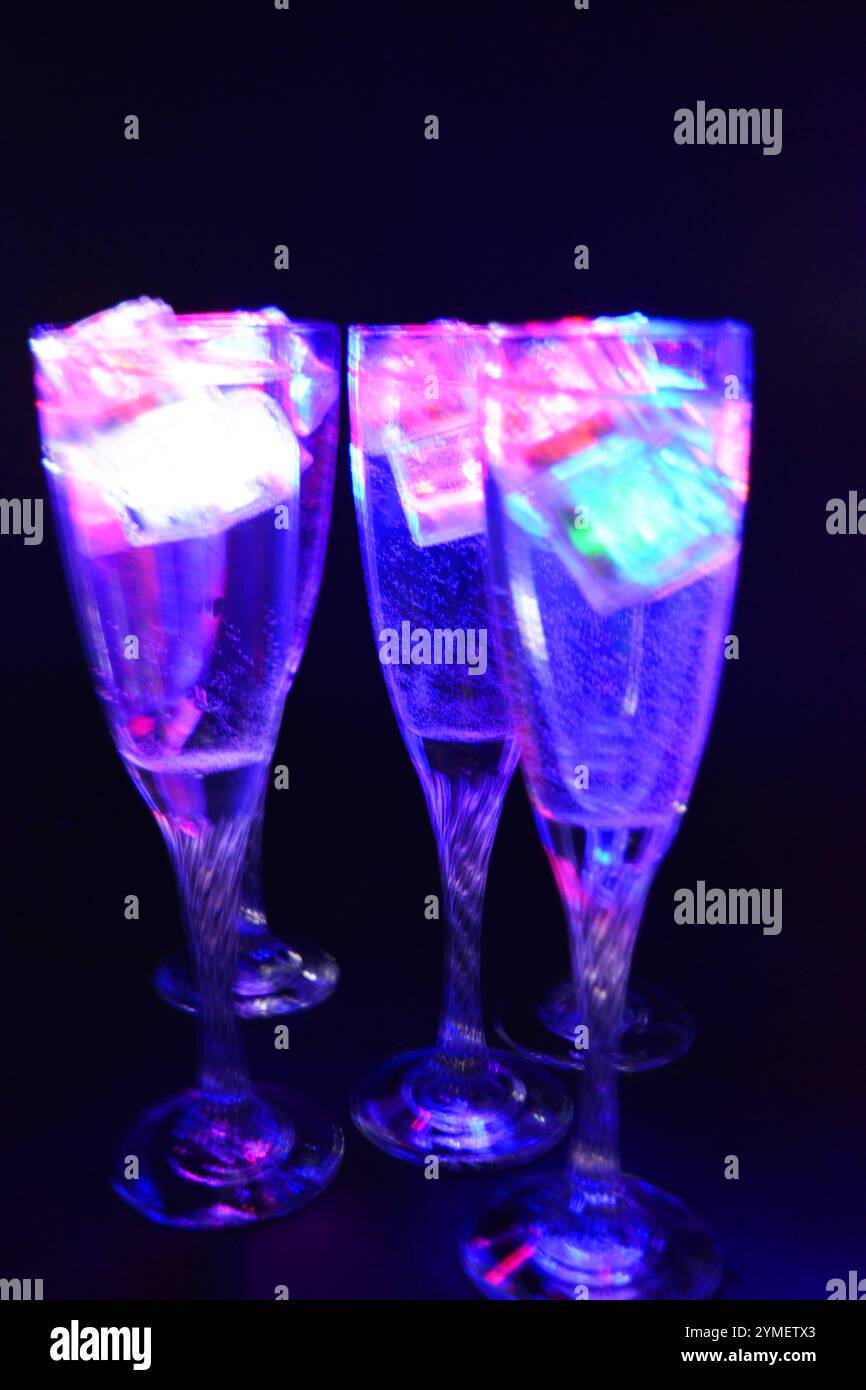 Colorful glasses, champagne glasses with fizzy drink, carbonated sweet ...