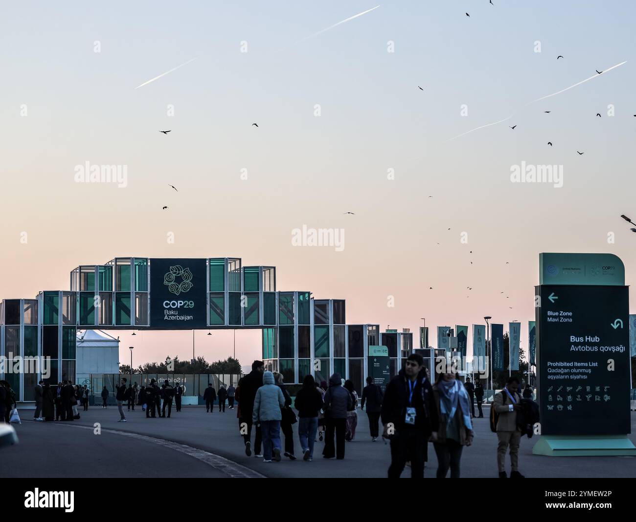 Baku, Azerbaijan. 21st Nov, 2024. Participants walk by a main entrance ...