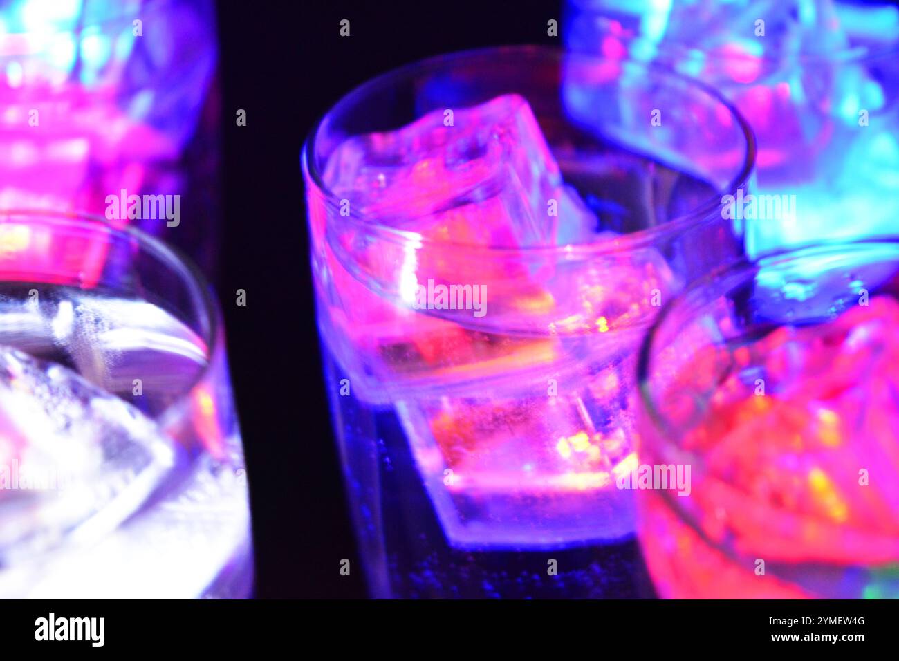 Colorful glasses, champagne glasses with fizzy drink, carbonated sweet ...