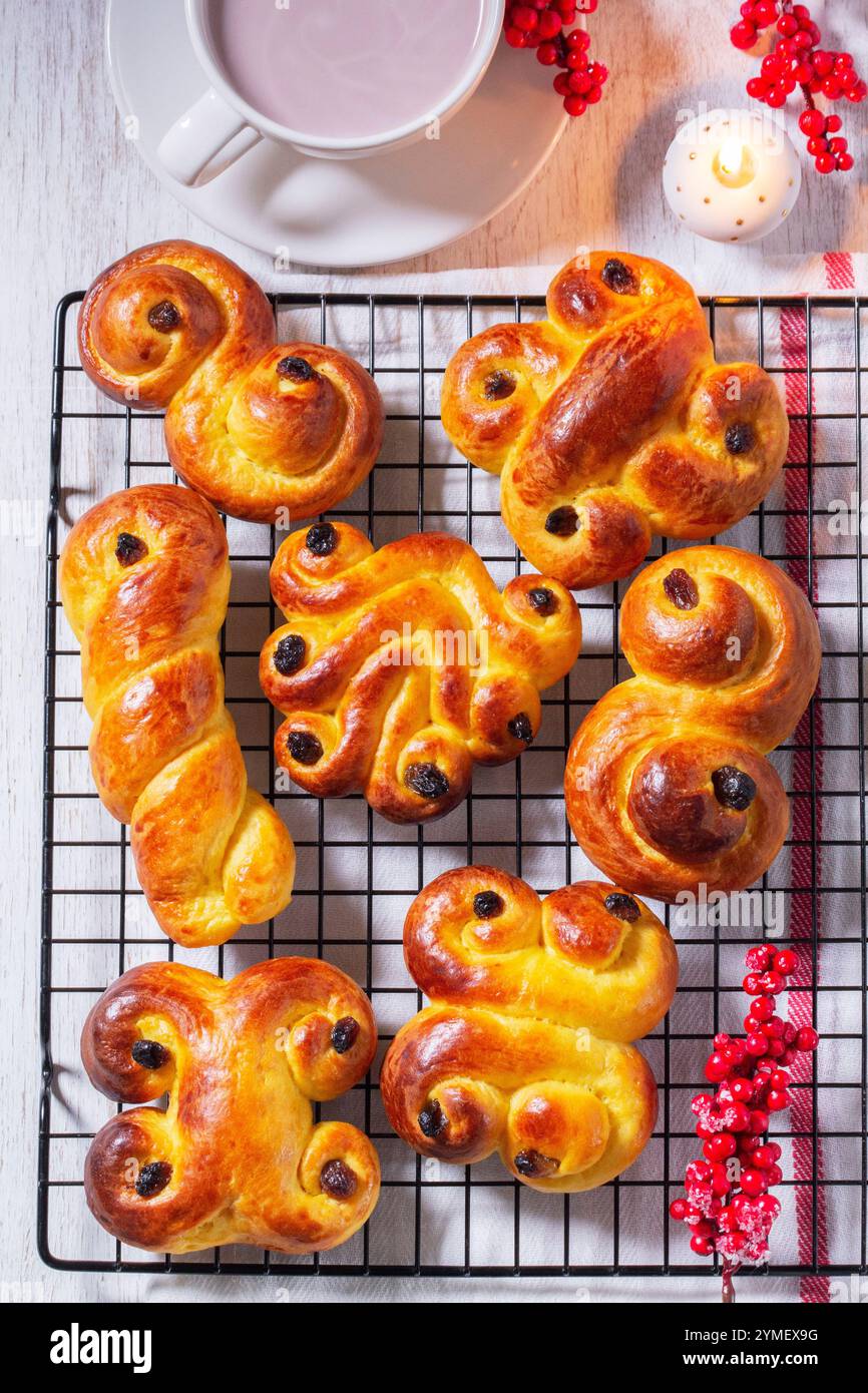 Traditional saffron Swedish buns lussekatt in different shapes, served ...