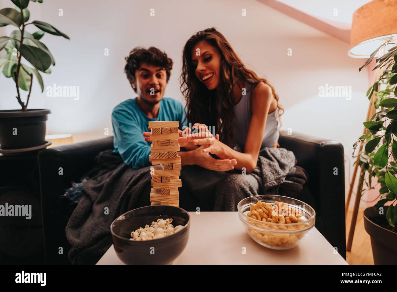 Happy friends playing jenga hi-res stock photography and images - Alamy