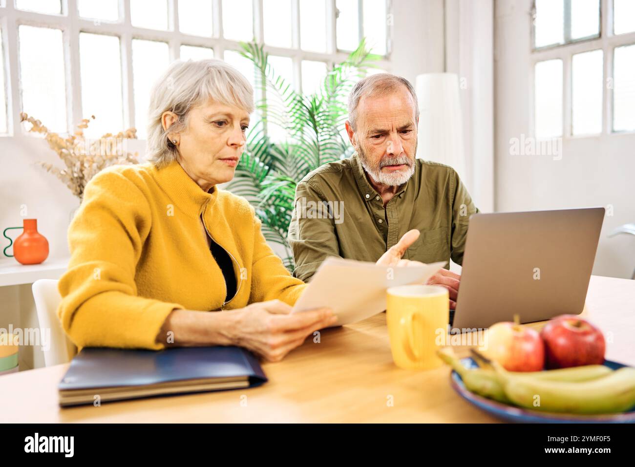 Couple analyzing bills finances hi-res stock photography and images - Alamy