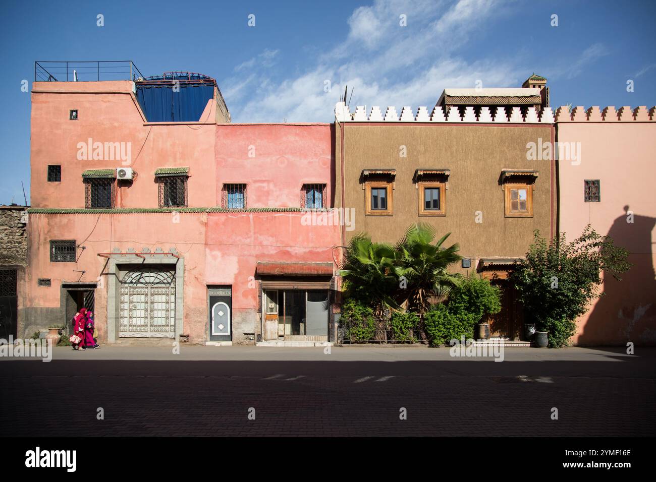 Colourful Moroccan street with pink and brown buildings, vibrant ...