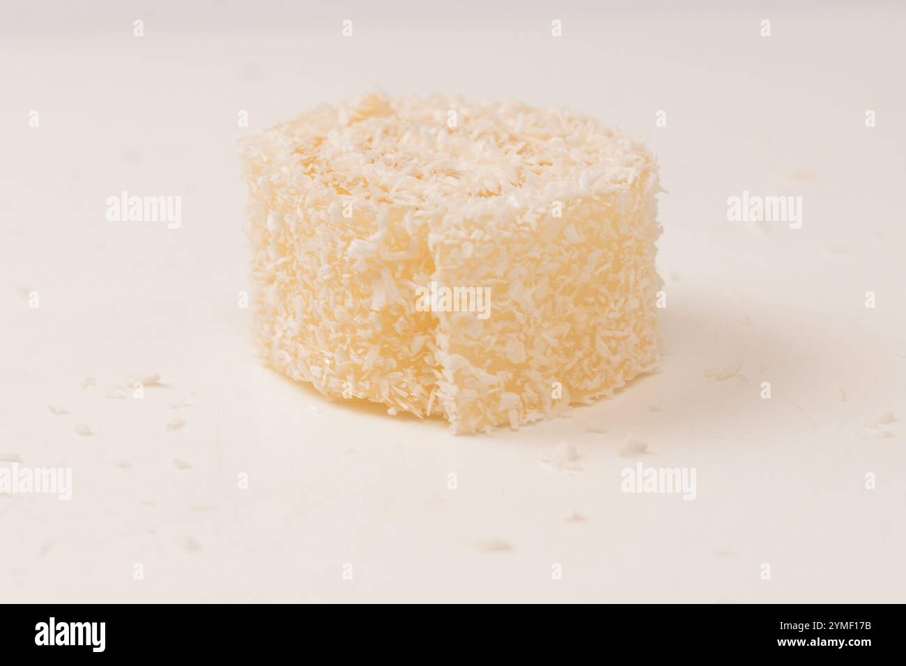 Coconut candy roll isolated on a white background Stock Photo - Alamy