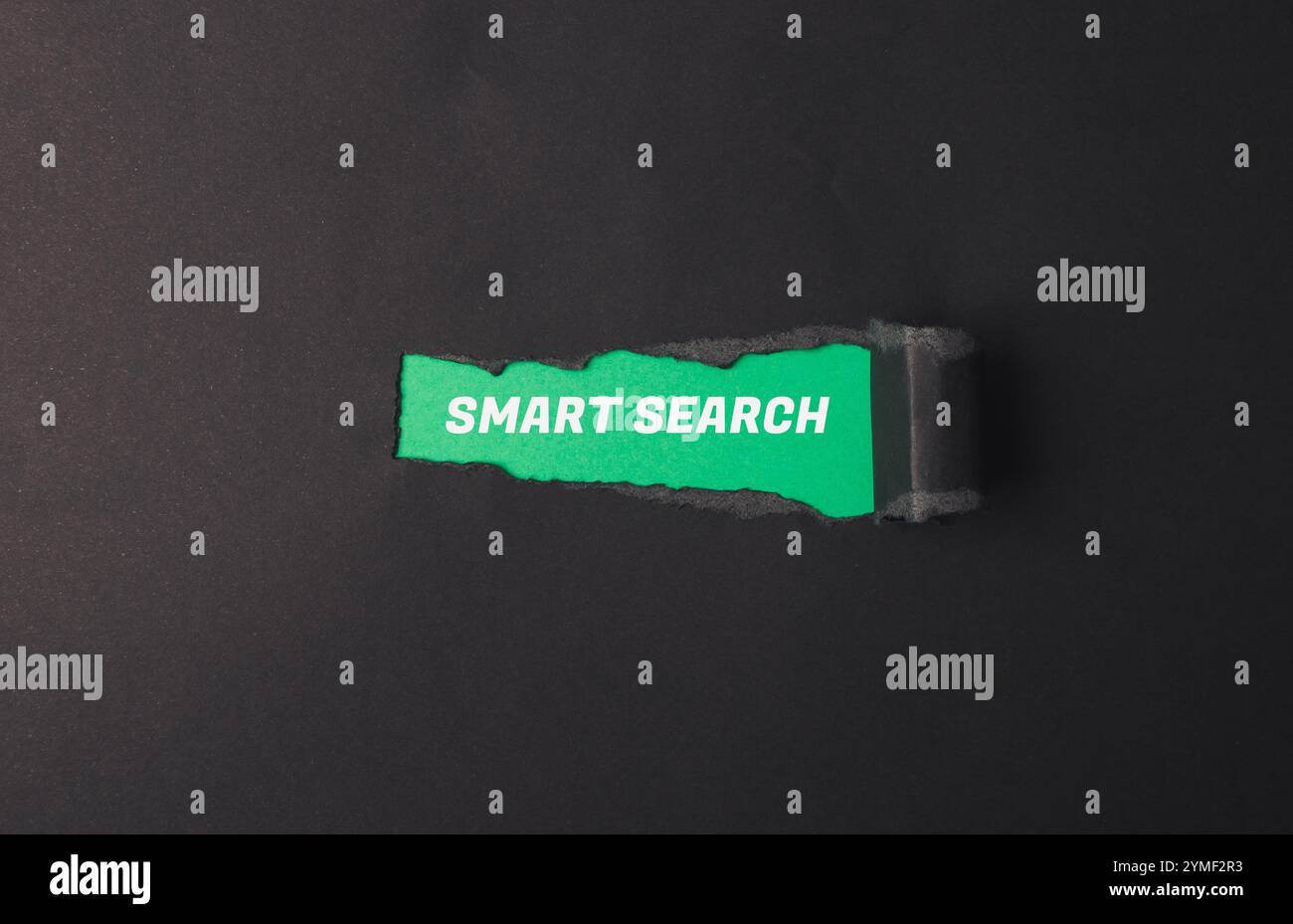 Green sign that says smart search is cut out of a black background. The ...