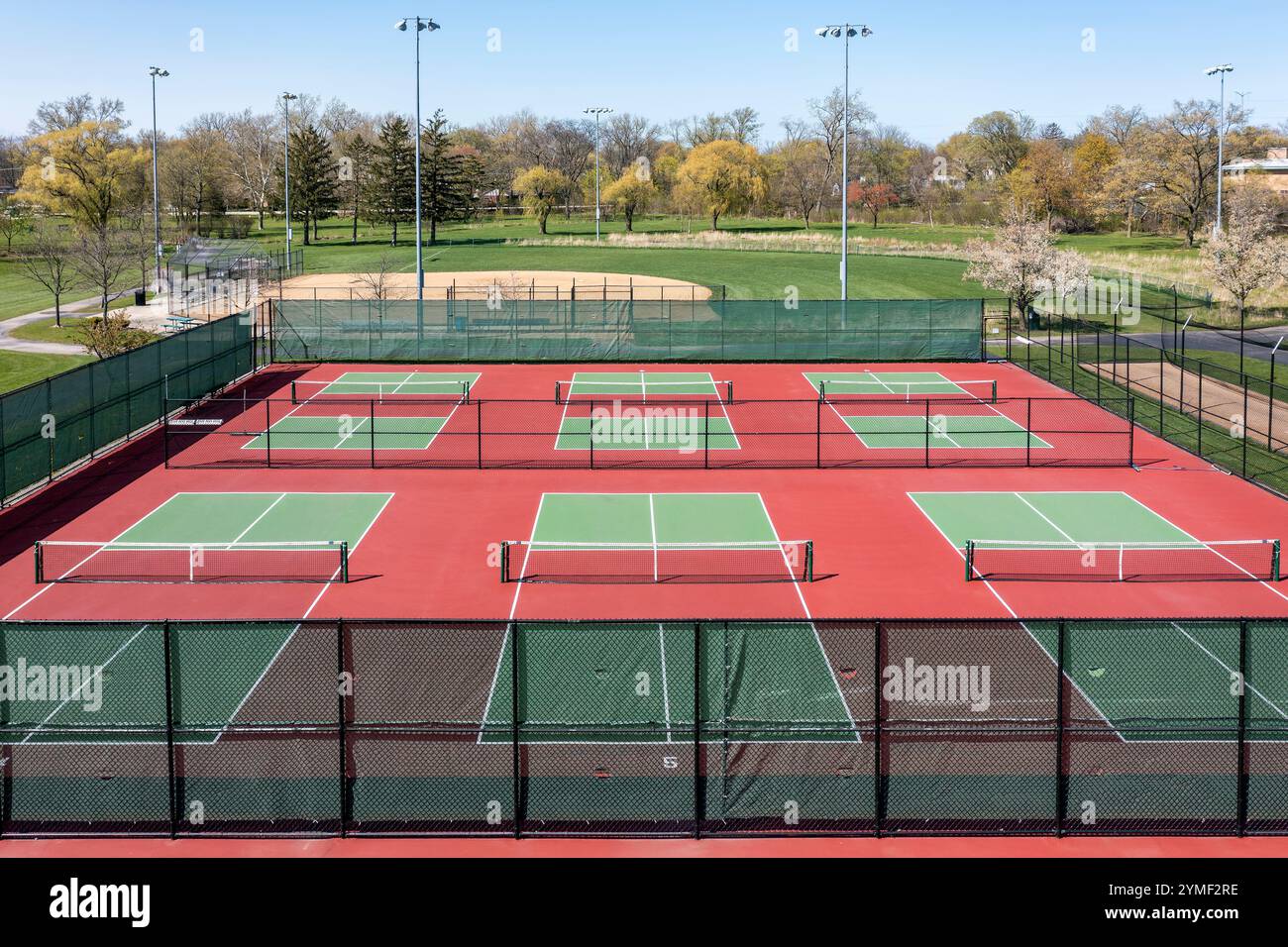 Aerial view of a new pickleball facility with blue and green courts in ...