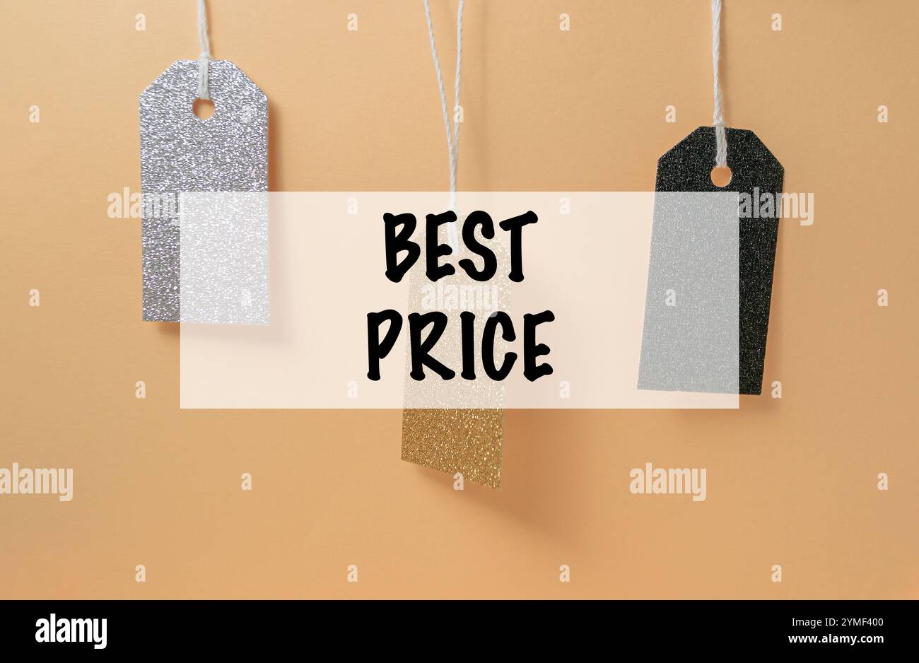 Three tags hanging from a string, each with a different price tag. The ...