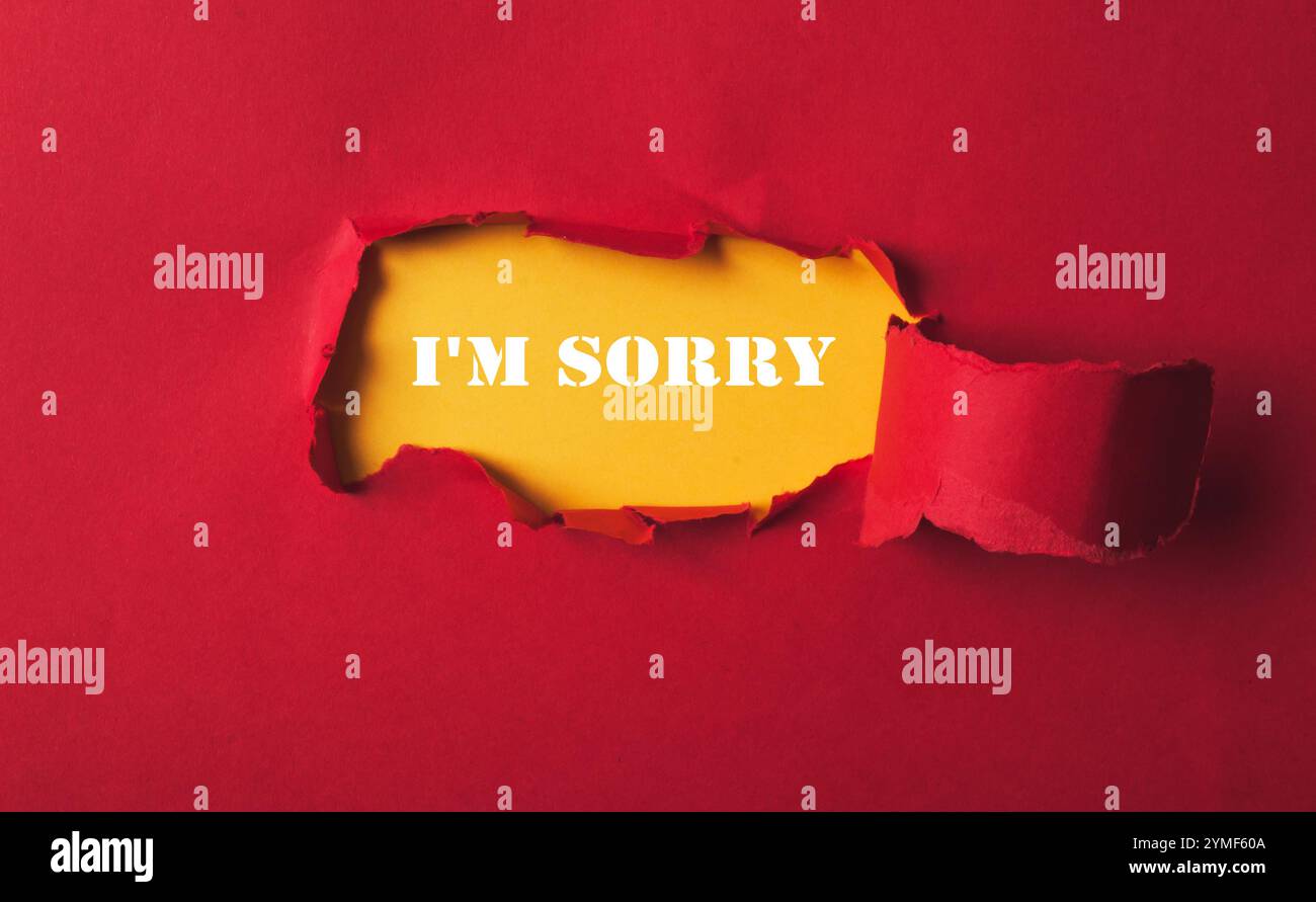 Red background with a hole in it and the words I'm sorry written in ...