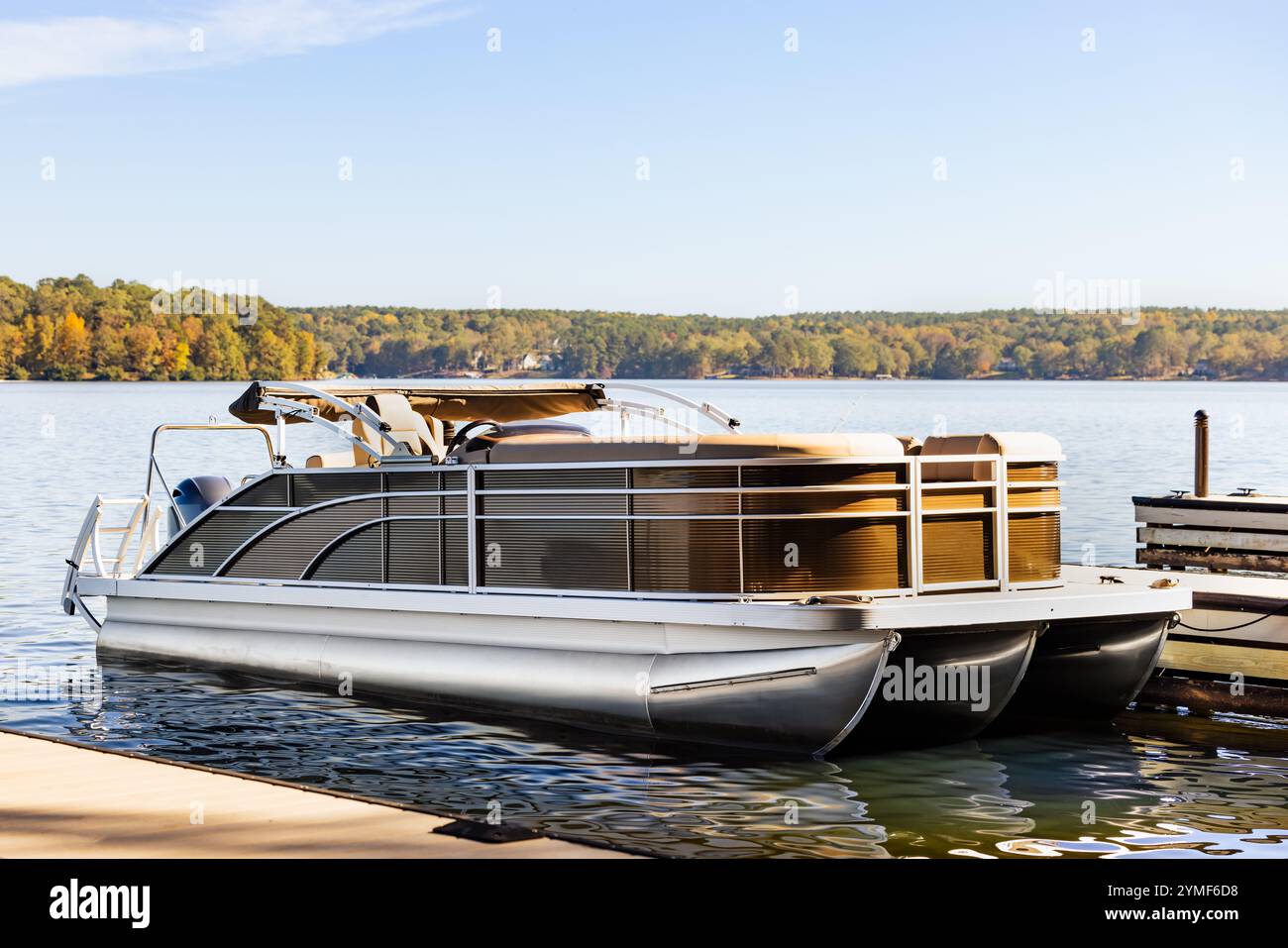 Pontoon boat at private marina dock on freshwater lake Stock Photo - Alamy