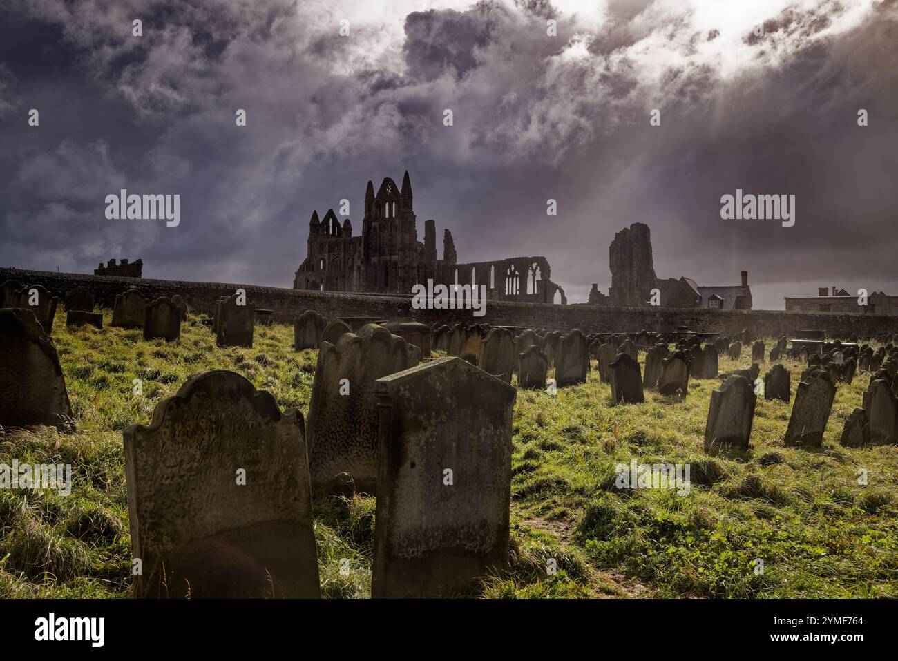 Sunshine breaks through stormy clouds at Whitby Abbey, England Stock ...