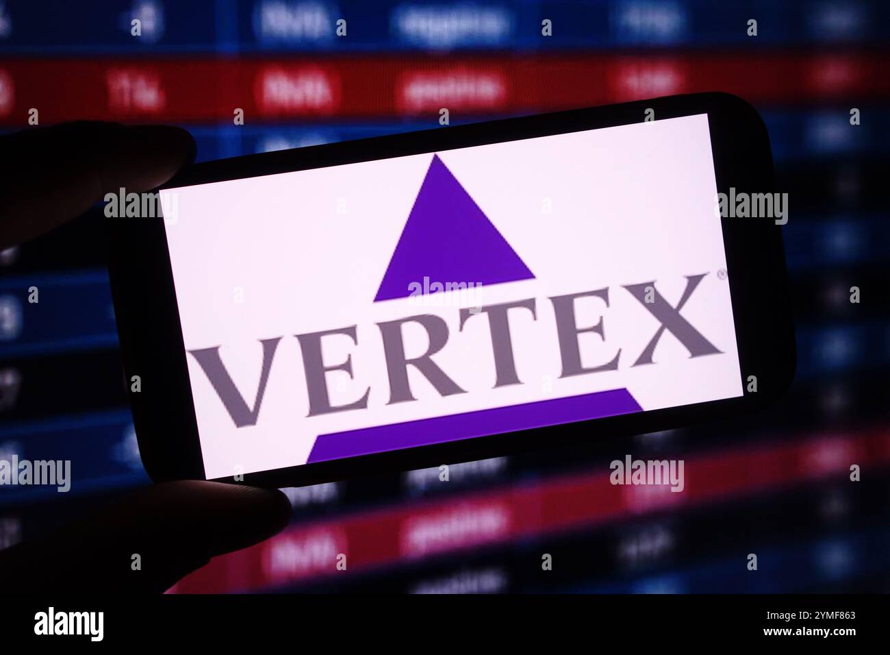 In this photo illustration, the Vertex Pharmaceuticals company logo is ...