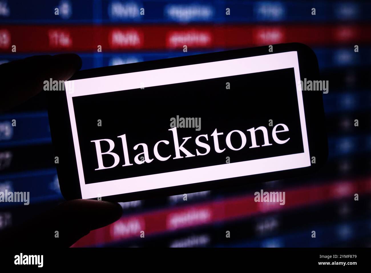 In this photo illustration, the Blackstone Group company logo is seen displayed on a smartphone ...