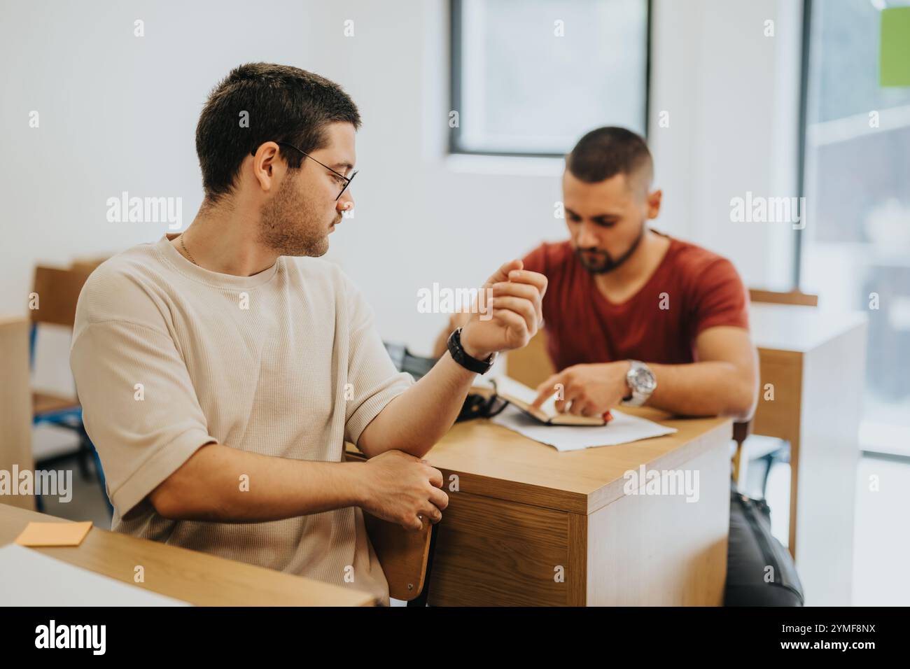 Focused high school students engaging in classroom discussion Stock ...