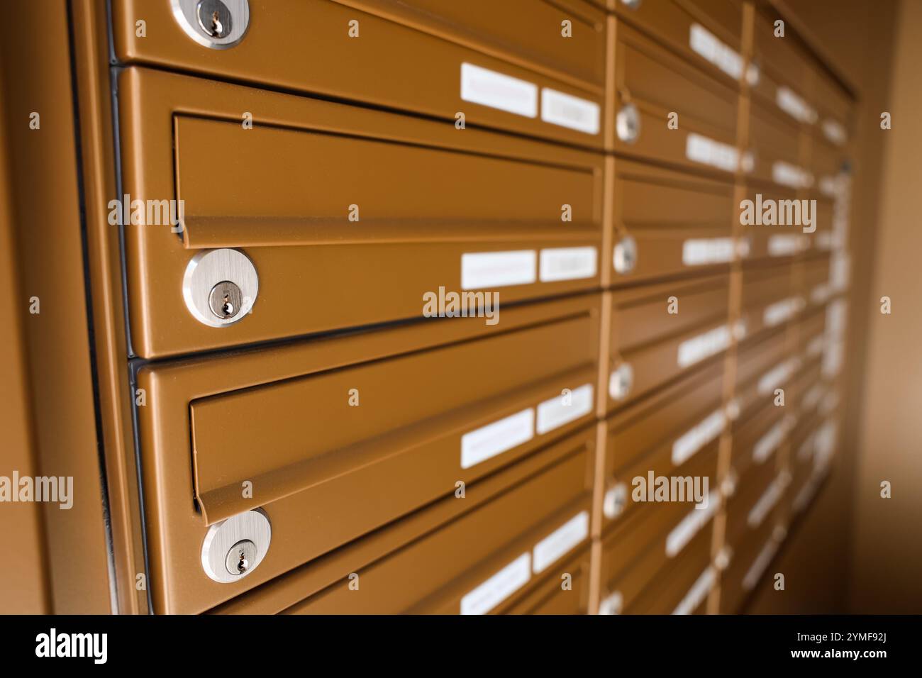 Brown mailboxes in residential building, closeup Stock Photo - Alamy