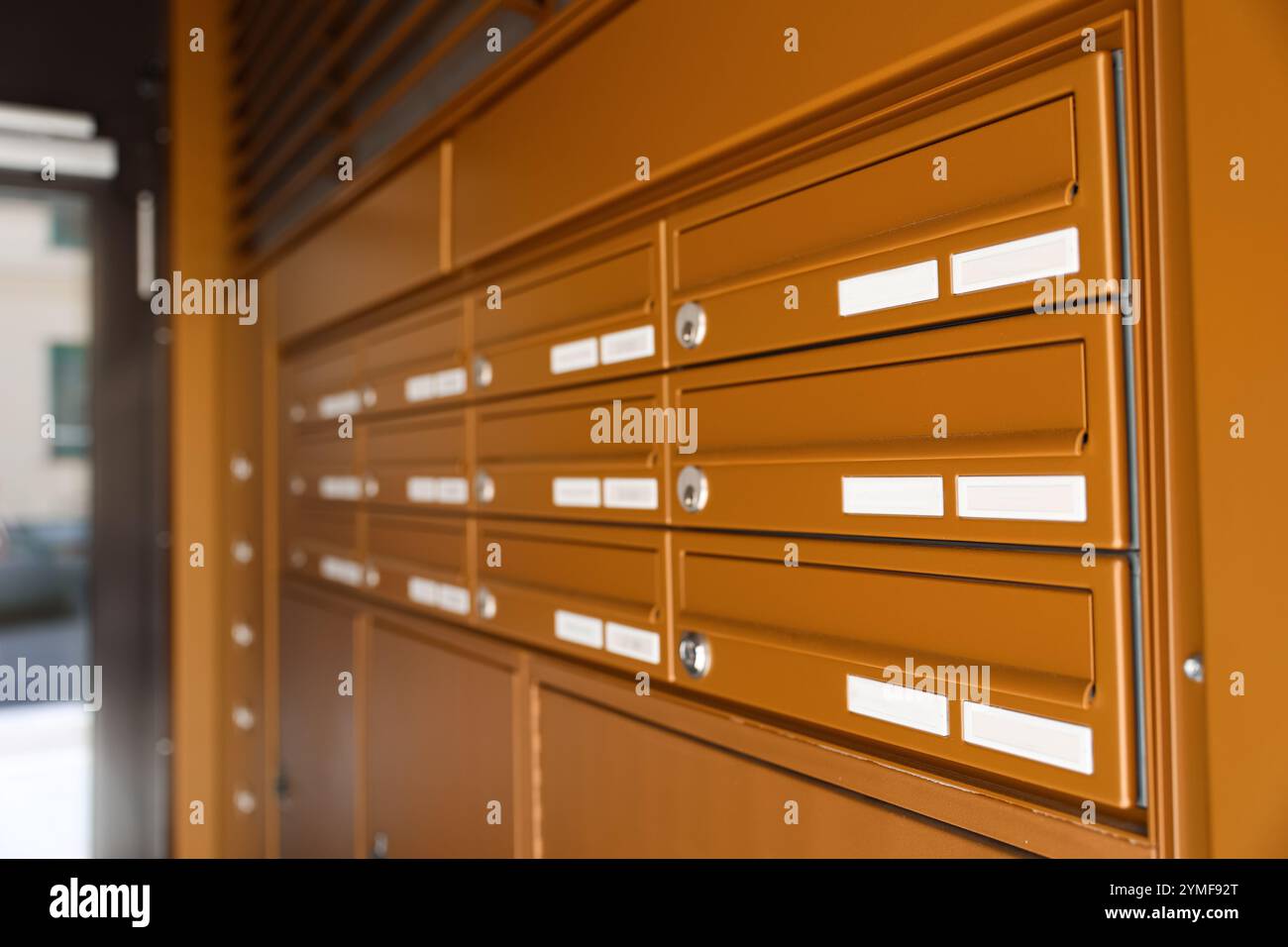 Brown mailboxes in residential building Stock Photo - Alamy