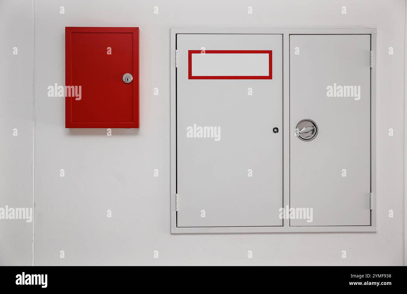 View of light wall with fire cabinets Stock Photo - Alamy
