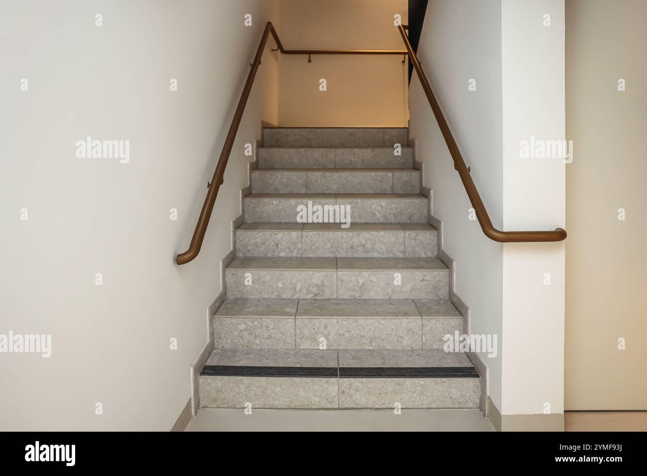 View of stairs with golden railing in modern building Stock Photo - Alamy