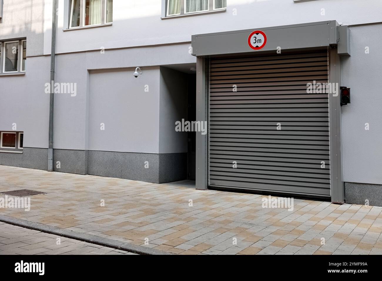 View of building with big window and roller shutters Stock Photo - Alamy