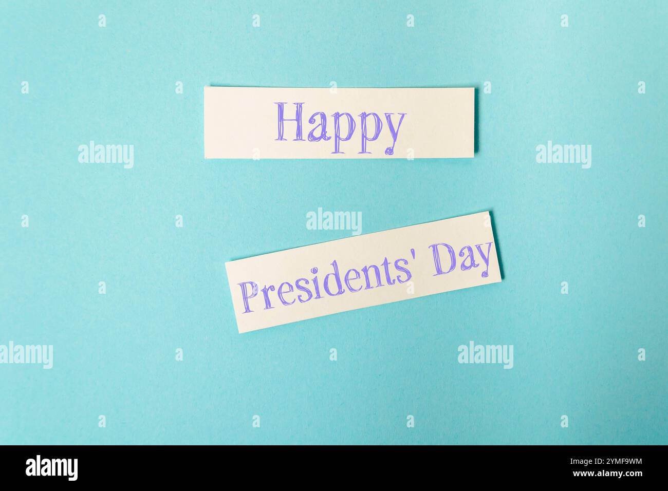 Blue background with two pieces of paper with the words Happy ...