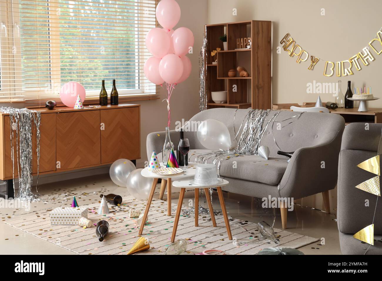 Interior of messy living room after Birthday celebration with sofa ...