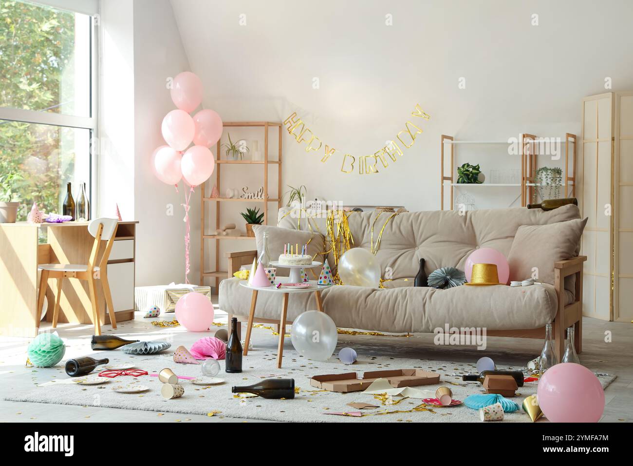 Interior of messy living room after Birthday celebration with sofa ...