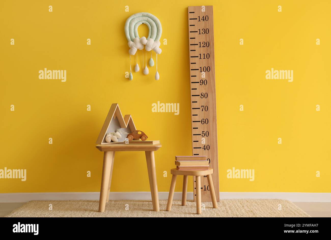 Interior of children's room with stadiometer, table and stool Stock ...