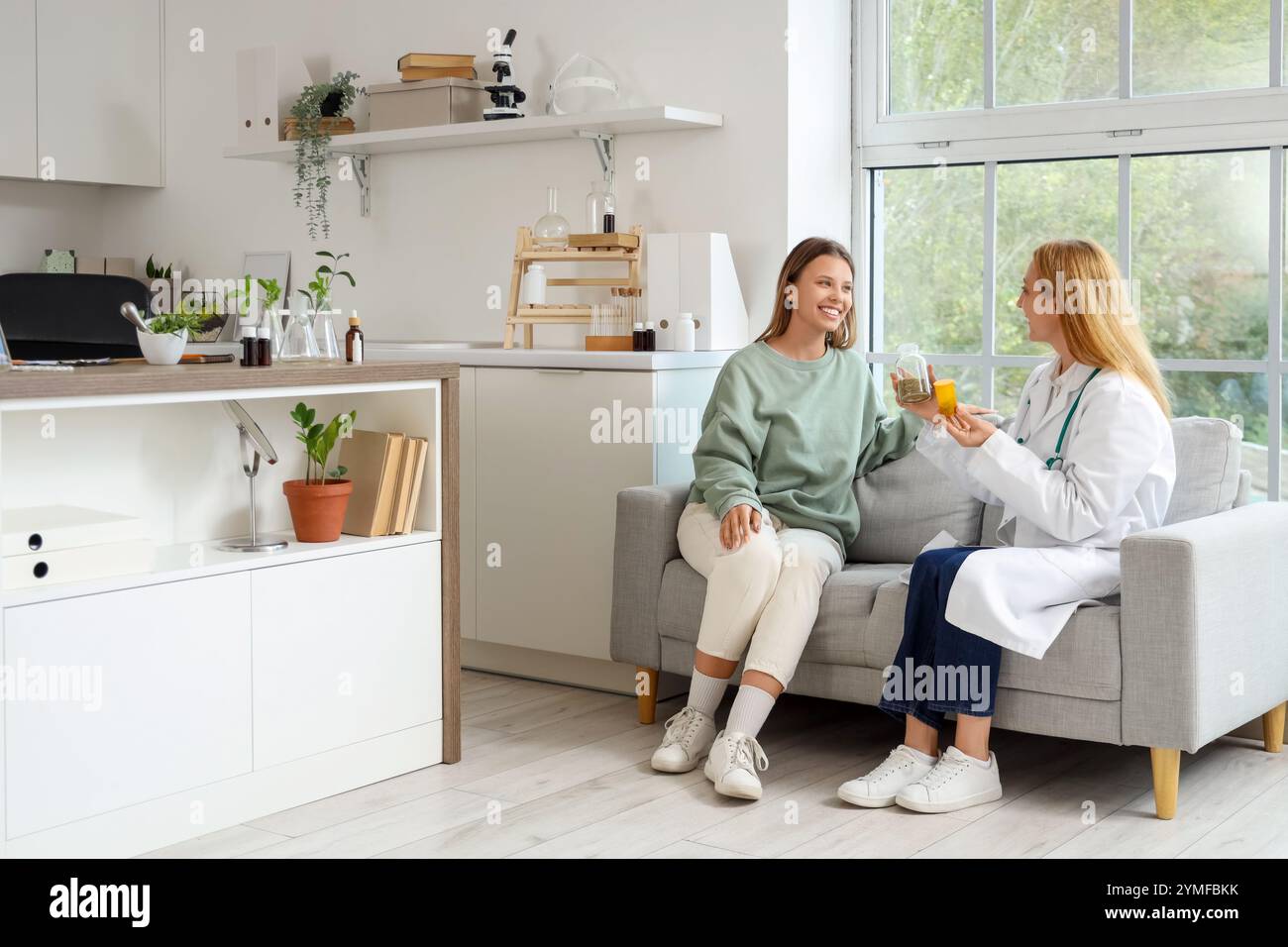 Female homeopathic doctor giving hi-res stock photography and images ...