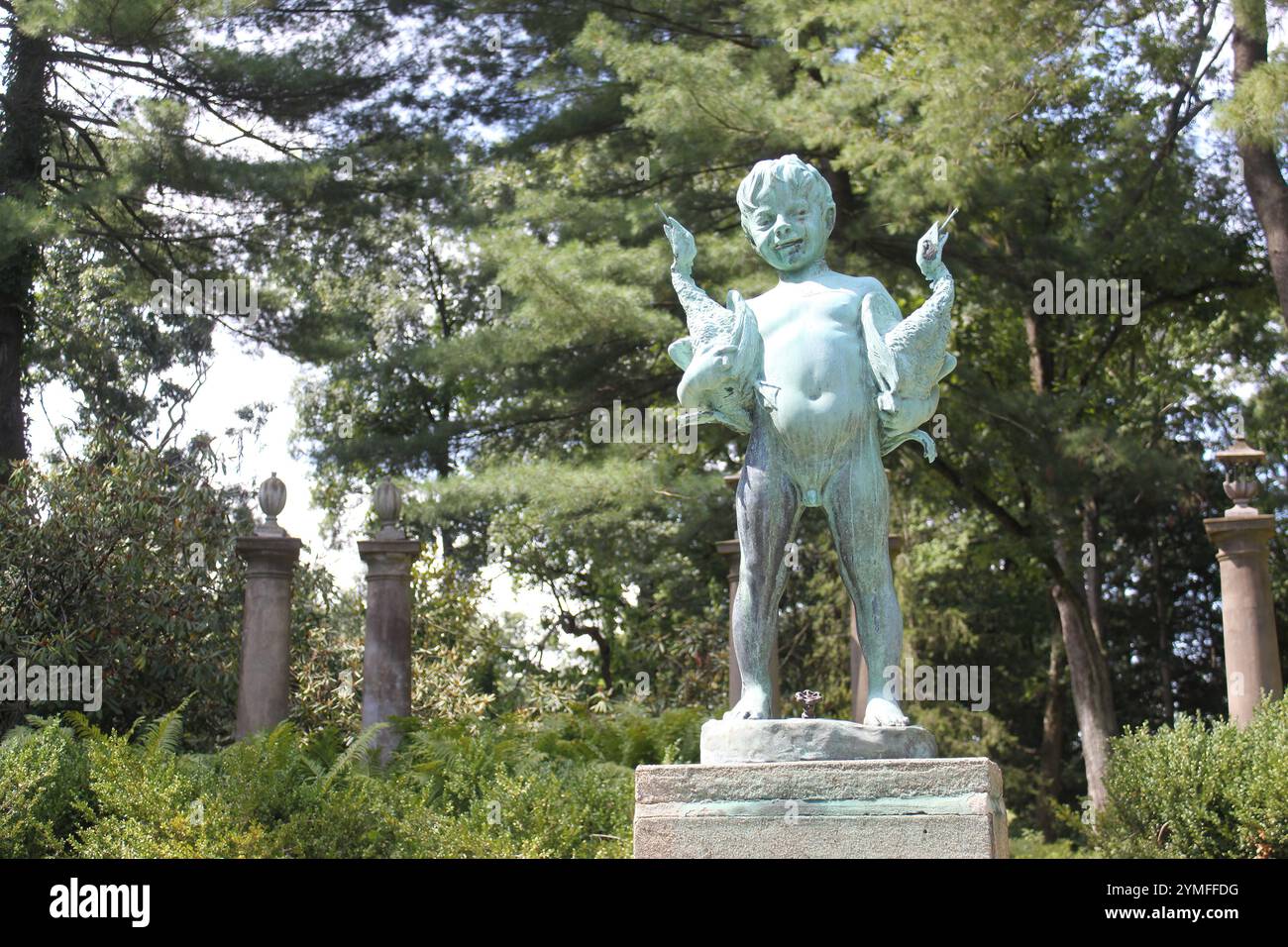 Bronze sculpture water feature park boy waterfowl hi-res stock ...