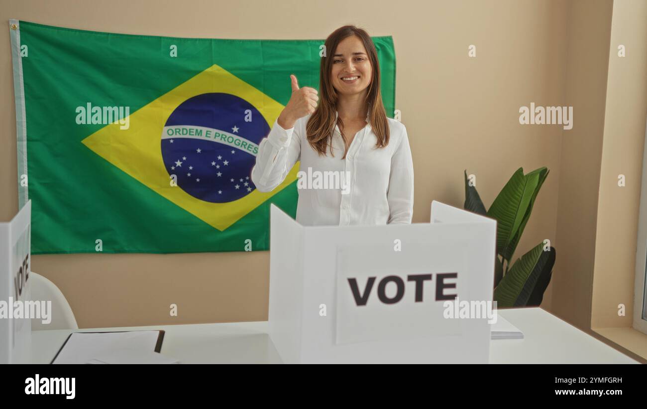 Young woman voting in an electoral college room with a brazilian flag ...