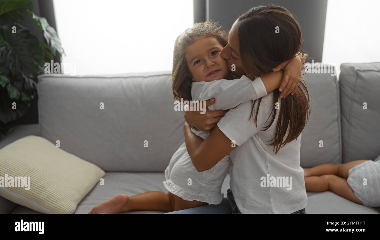 Woman hugging daughter lovingly in a cozy living room, expressing ...