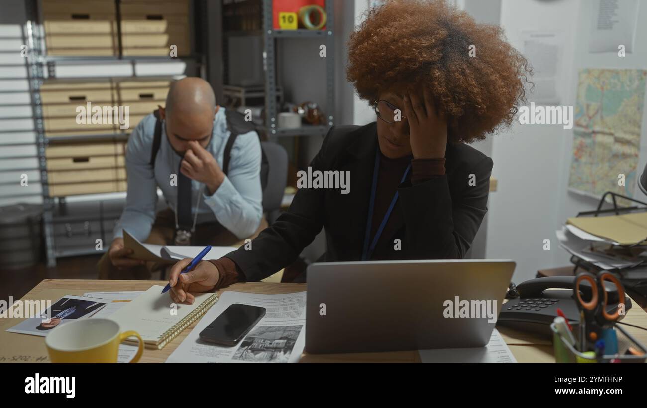 A concerned woman and man analyze documents in a cluttered detective ...