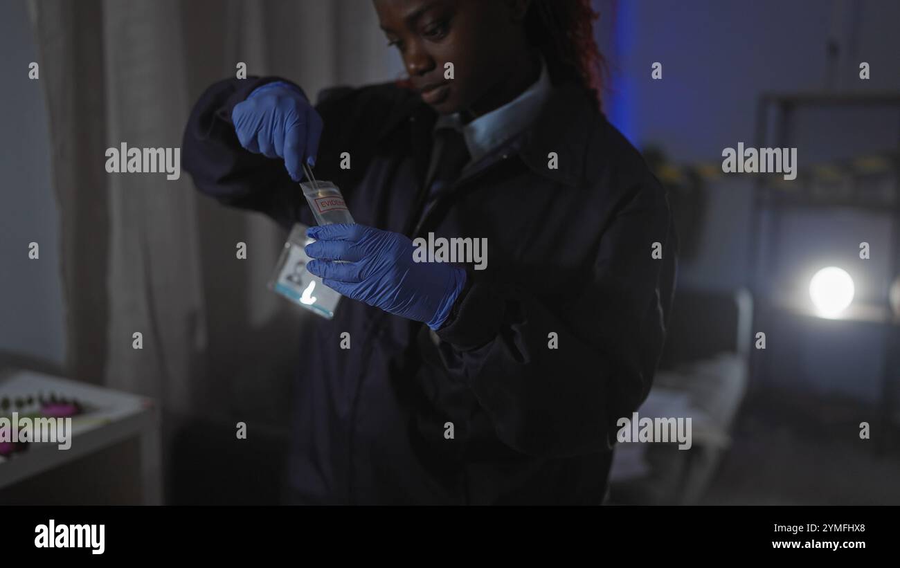 African american woman detective analyzing evidence at crime scene ...