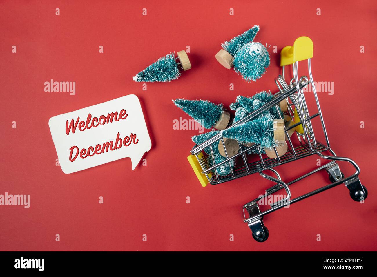 Cart full of Christmas trees is on a red background with the words ...