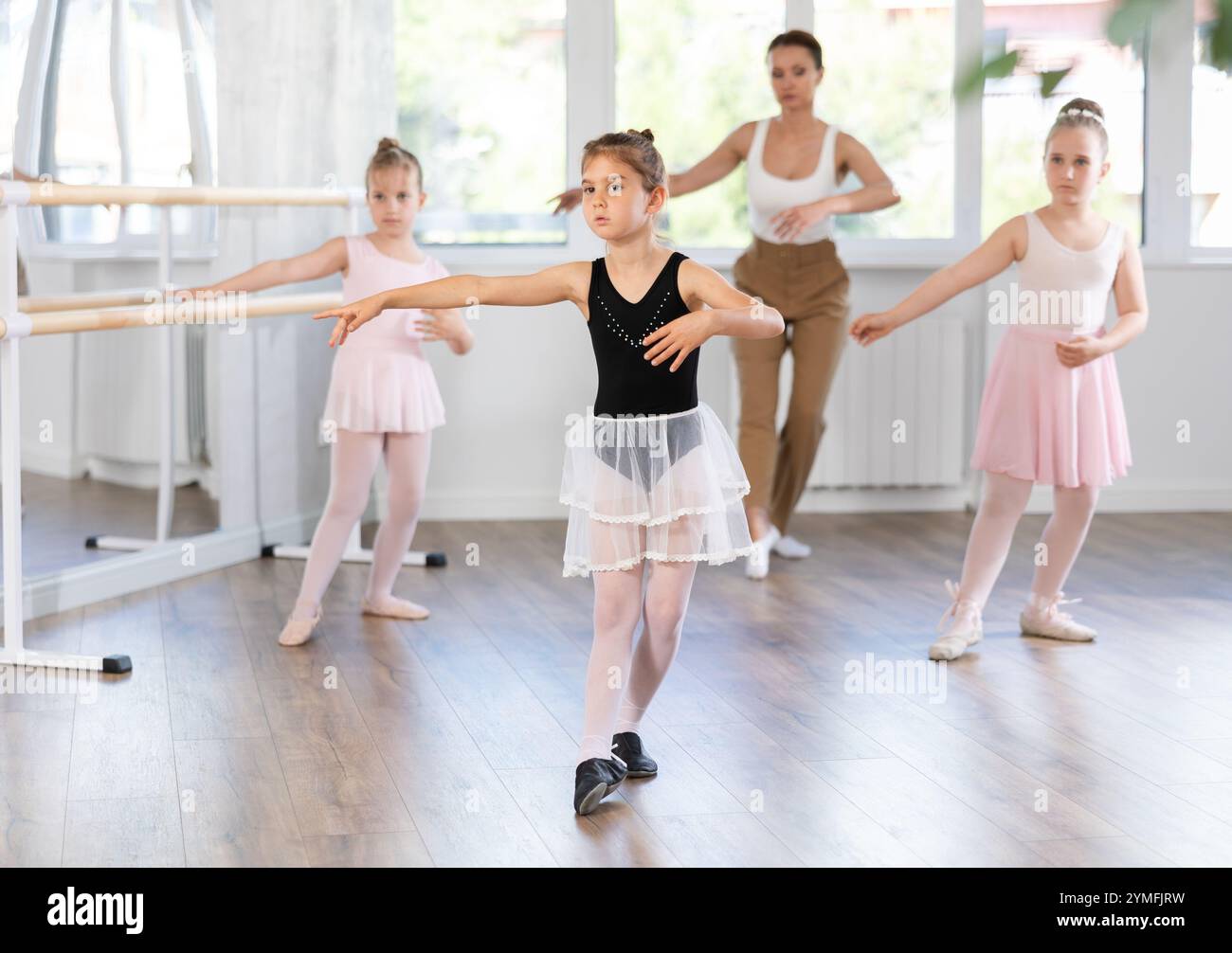 Group of girls rehearsing ballet moves Stock Photo - Alamy