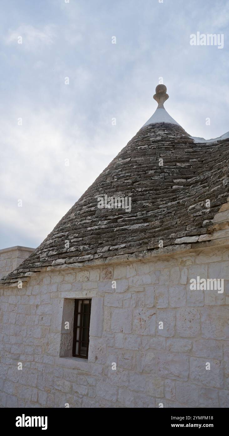 Traditional trullo house with a stone roof in the picturesque town of ...