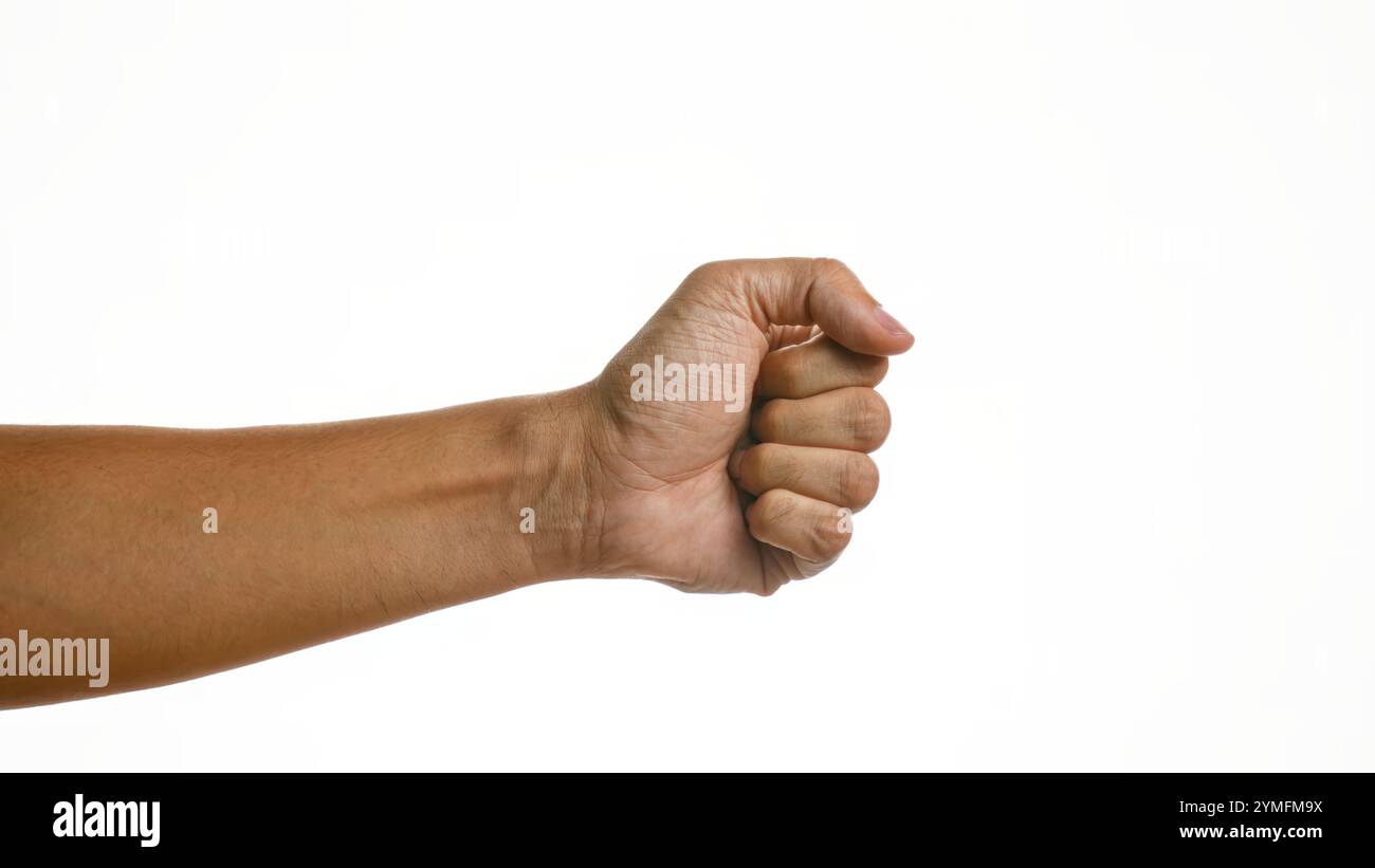 Man showing fist over isolated white background in a symbolic gesture ...