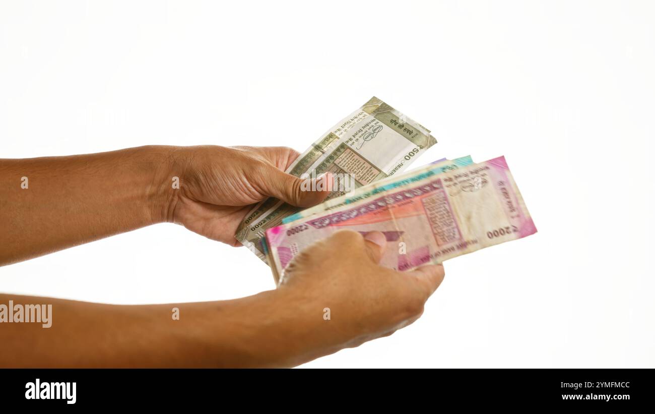 Hands counting indian rupee currency over isolated white background ...