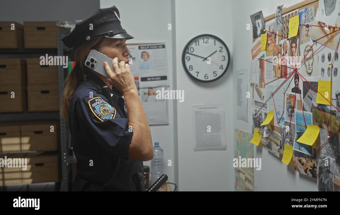 A focused police woman investigates in an office, surrounded by ...