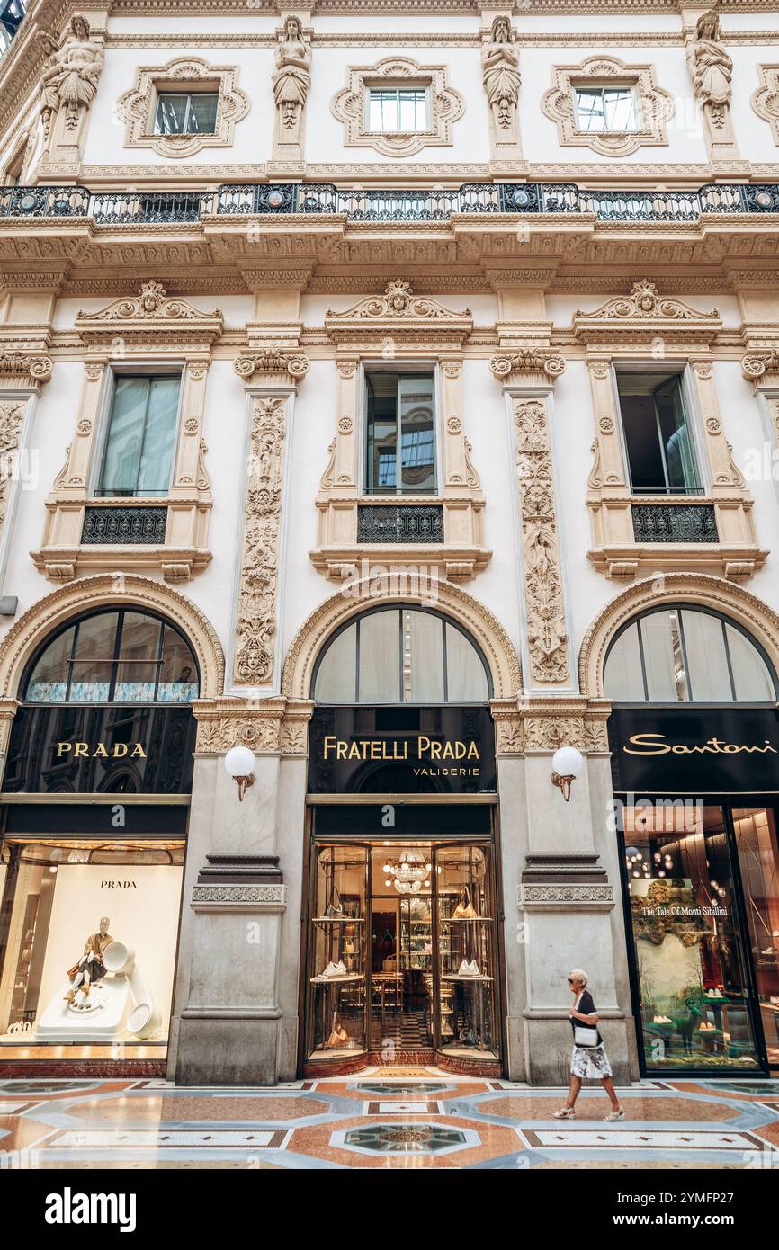 Milan, Italy - August 20, 2024: The facade of the first Prada store with the historic sign ...