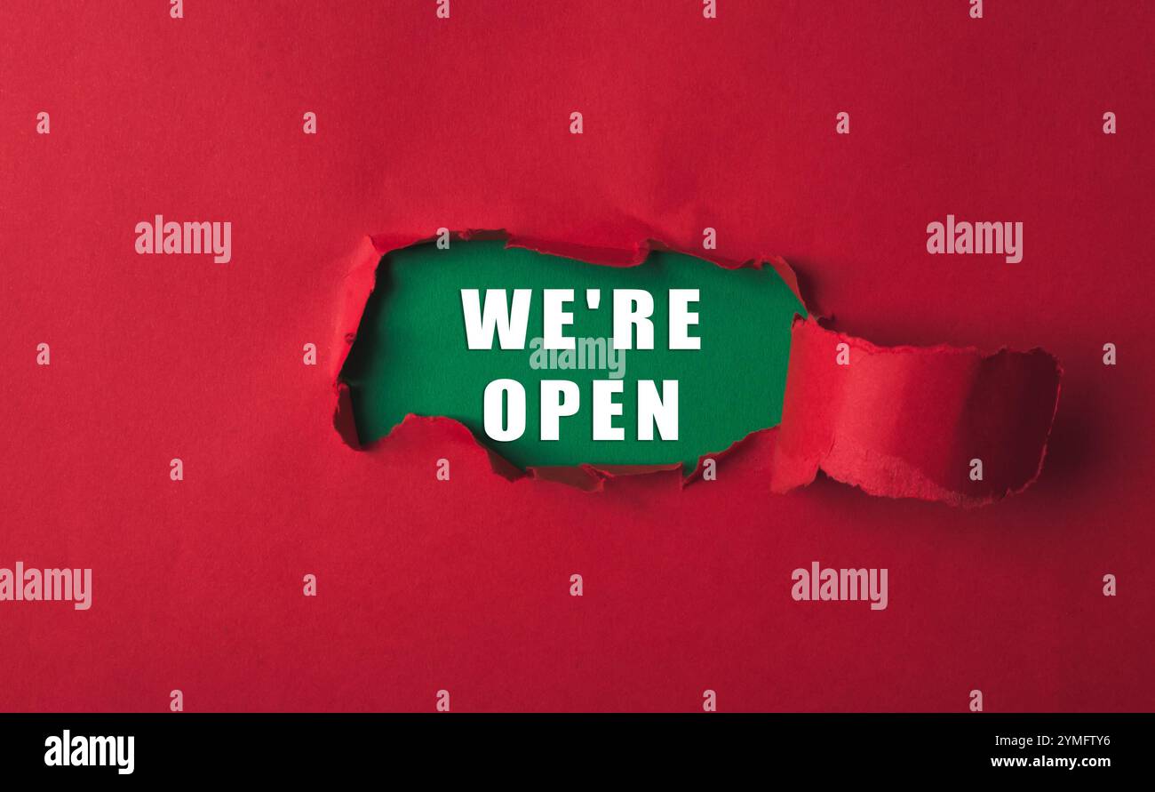 Red background with a green word that says we're open in white. The ...