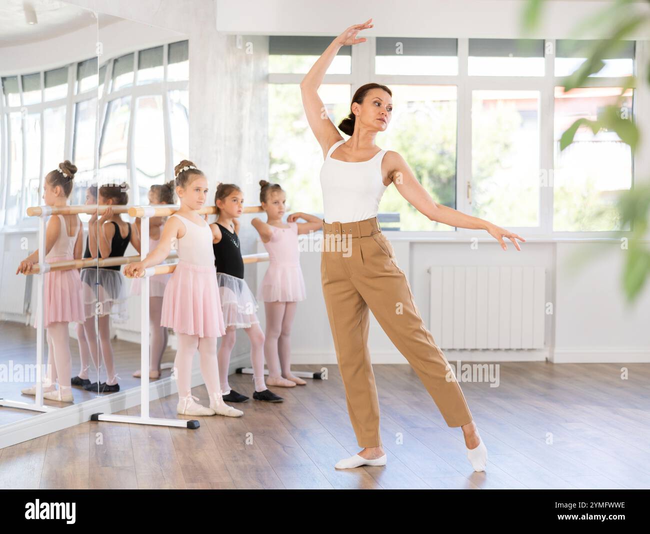 Female teacher shows girl hi-res stock photography and images - Alamy