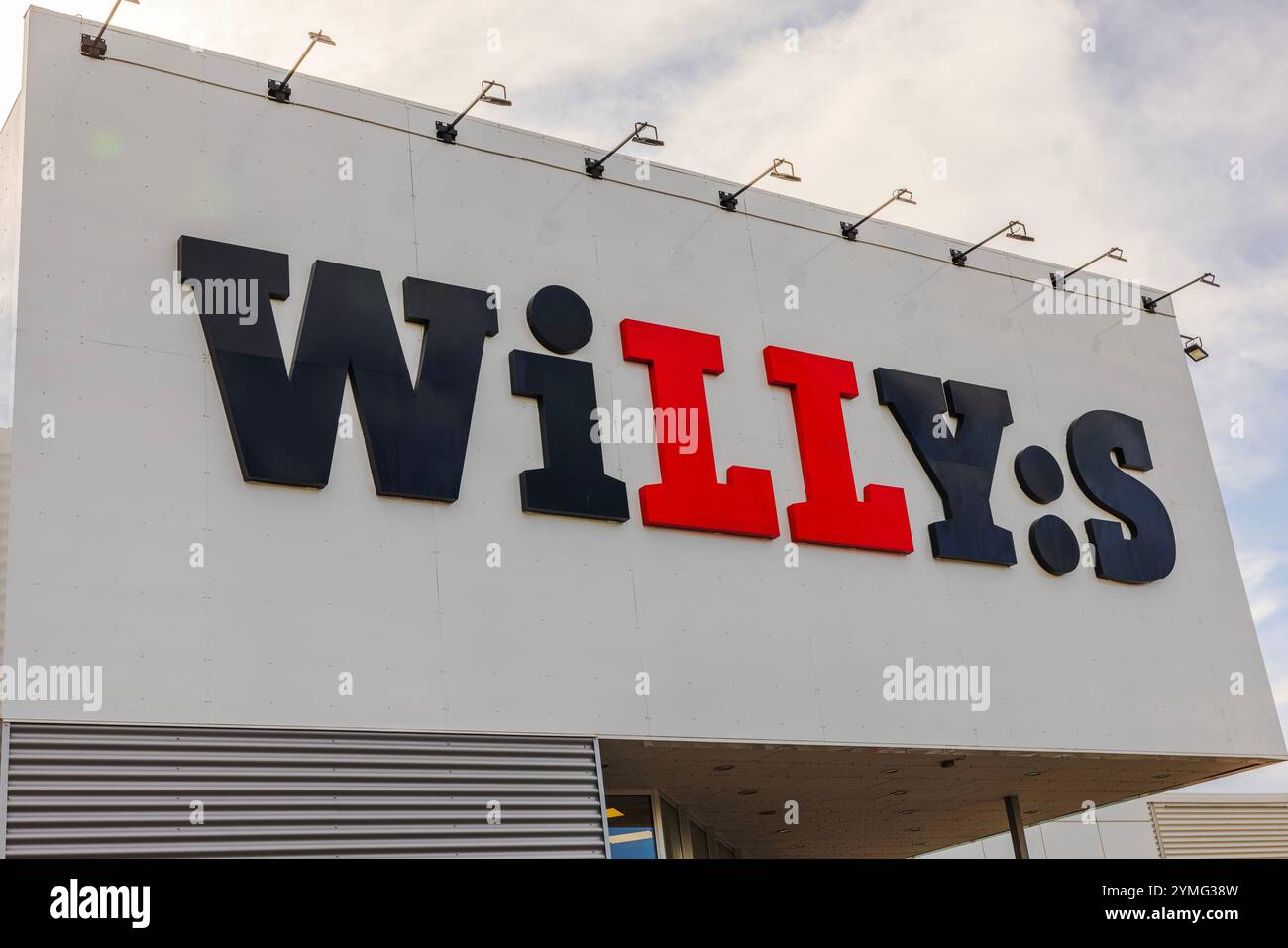 Logo of Willy:s supermarket chain on white building facade against ...
